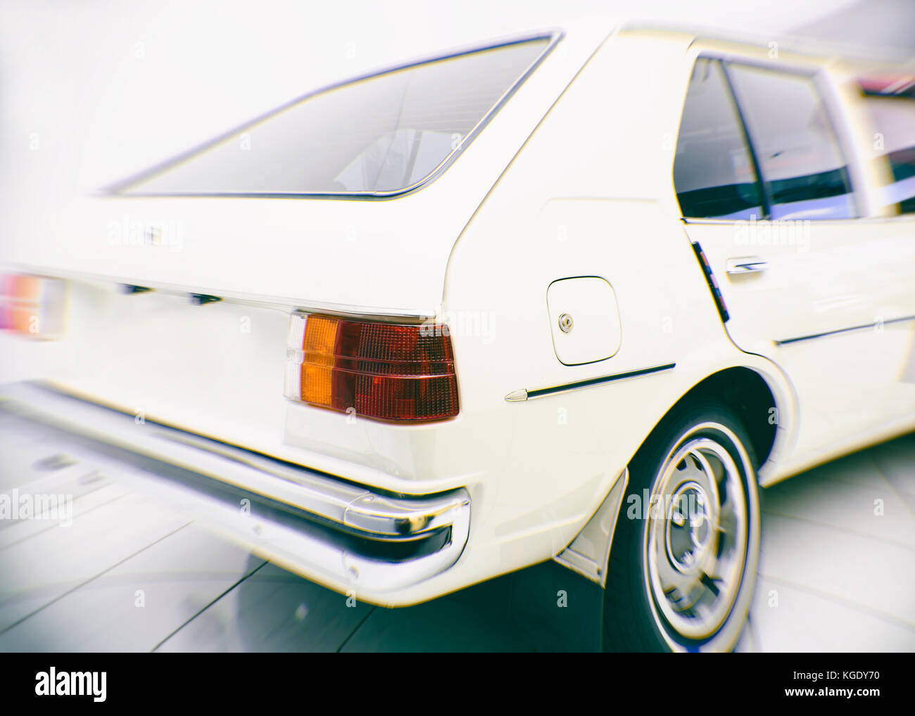 Stylish white retro hatchback car with rear and side windows, tail ...