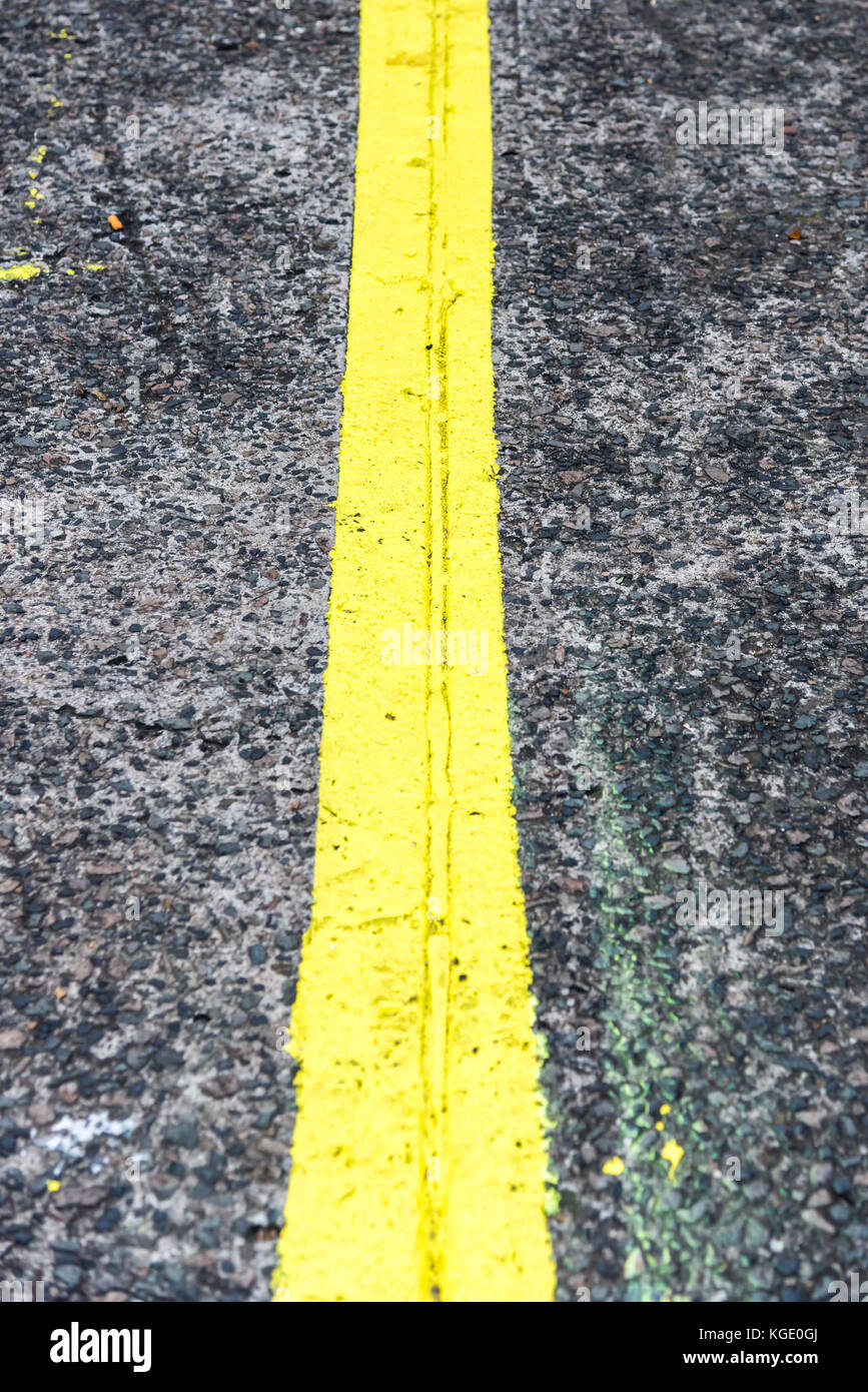 Top view of road with yellow line in middle, vertical. High angle view ...