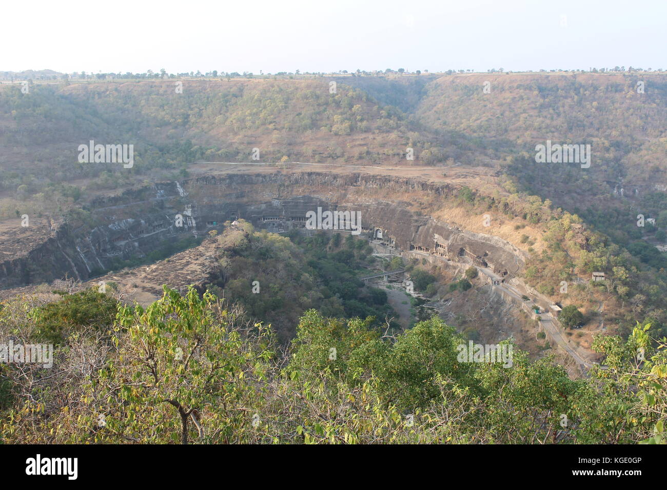 Ancient caves carved into the mountain wall hi-res stock photography ...