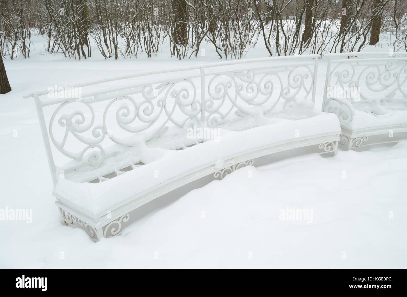 Bench for rest and snow have the same white color Stock Photo - Alamy