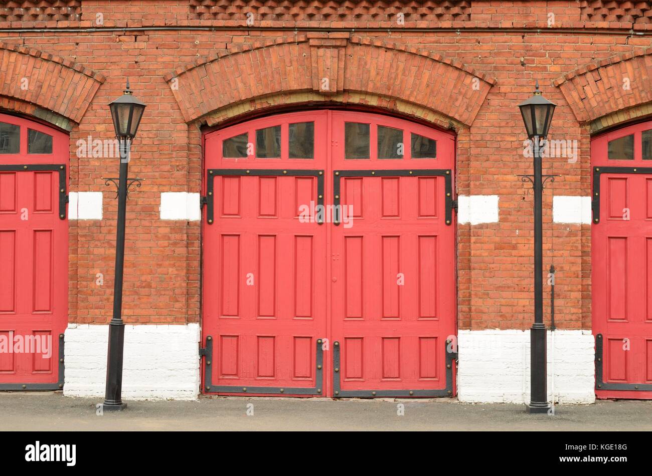 Gate fire station painted red Stock Photo - Alamy