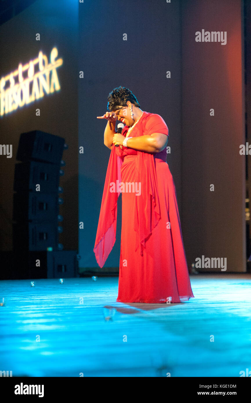 Gospel afro american mature famous singer performing during a night ...