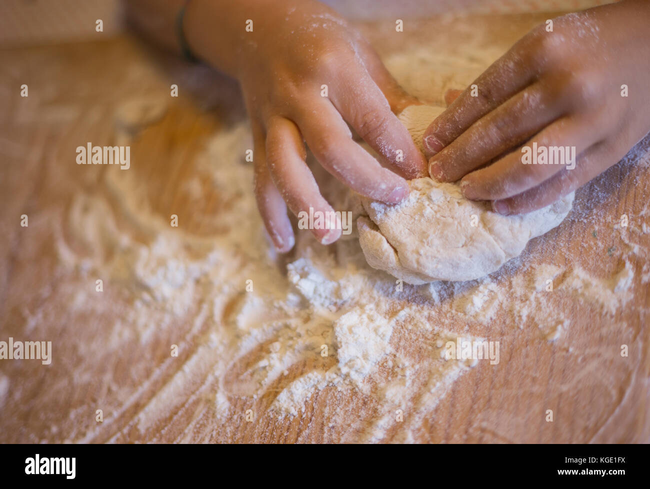 Floured baby hands for homemade pasta processing Stock Photo - Alamy