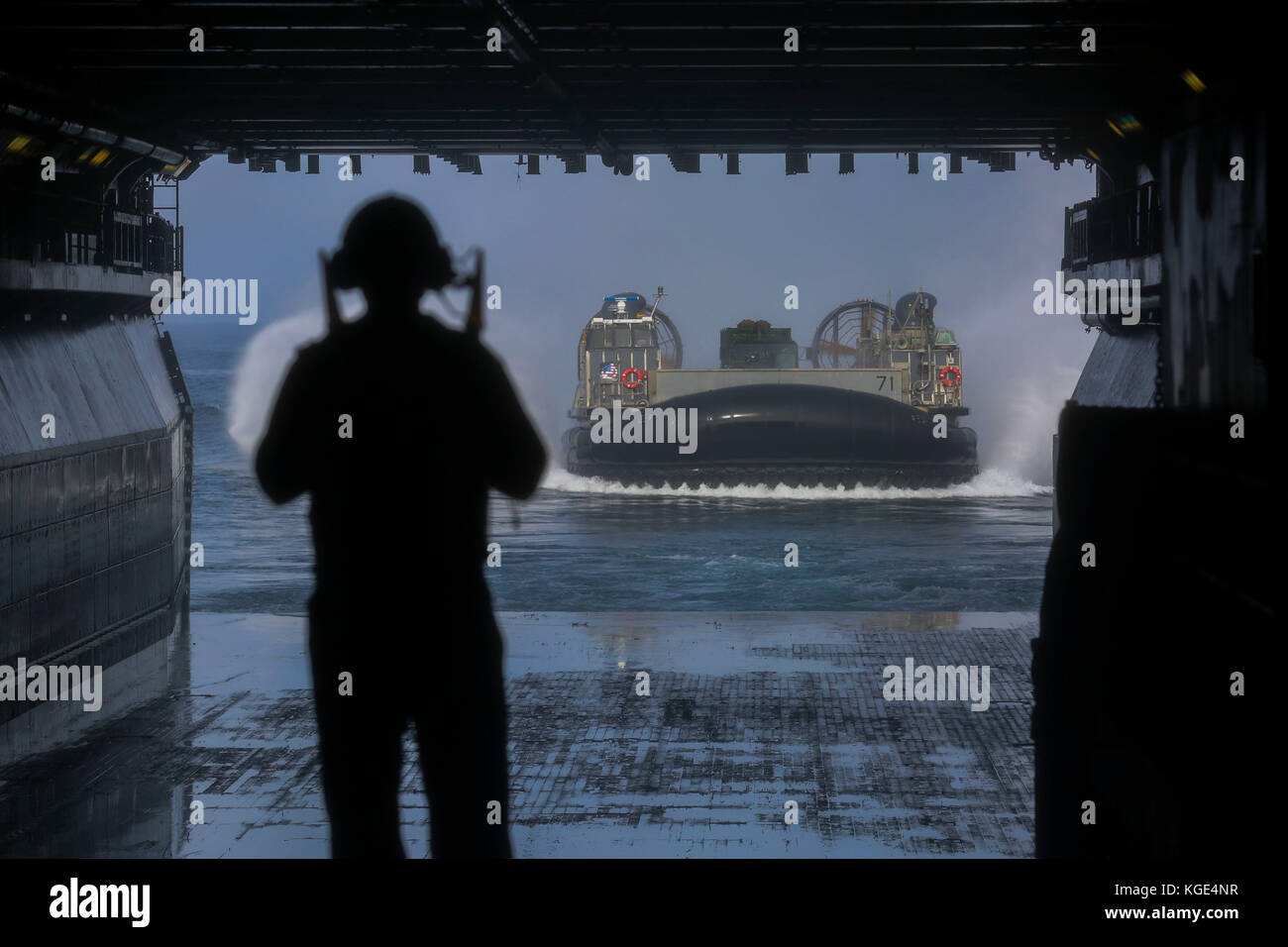 Landing Craft, Air Cushion 71 (LCAC) approaches the well deck of the ...