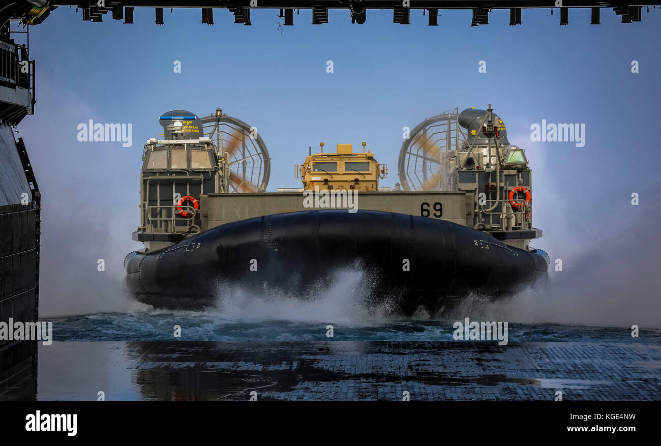 Landing Craft, Air Cushion 69 (LCAC) approaches the well deck of the ...