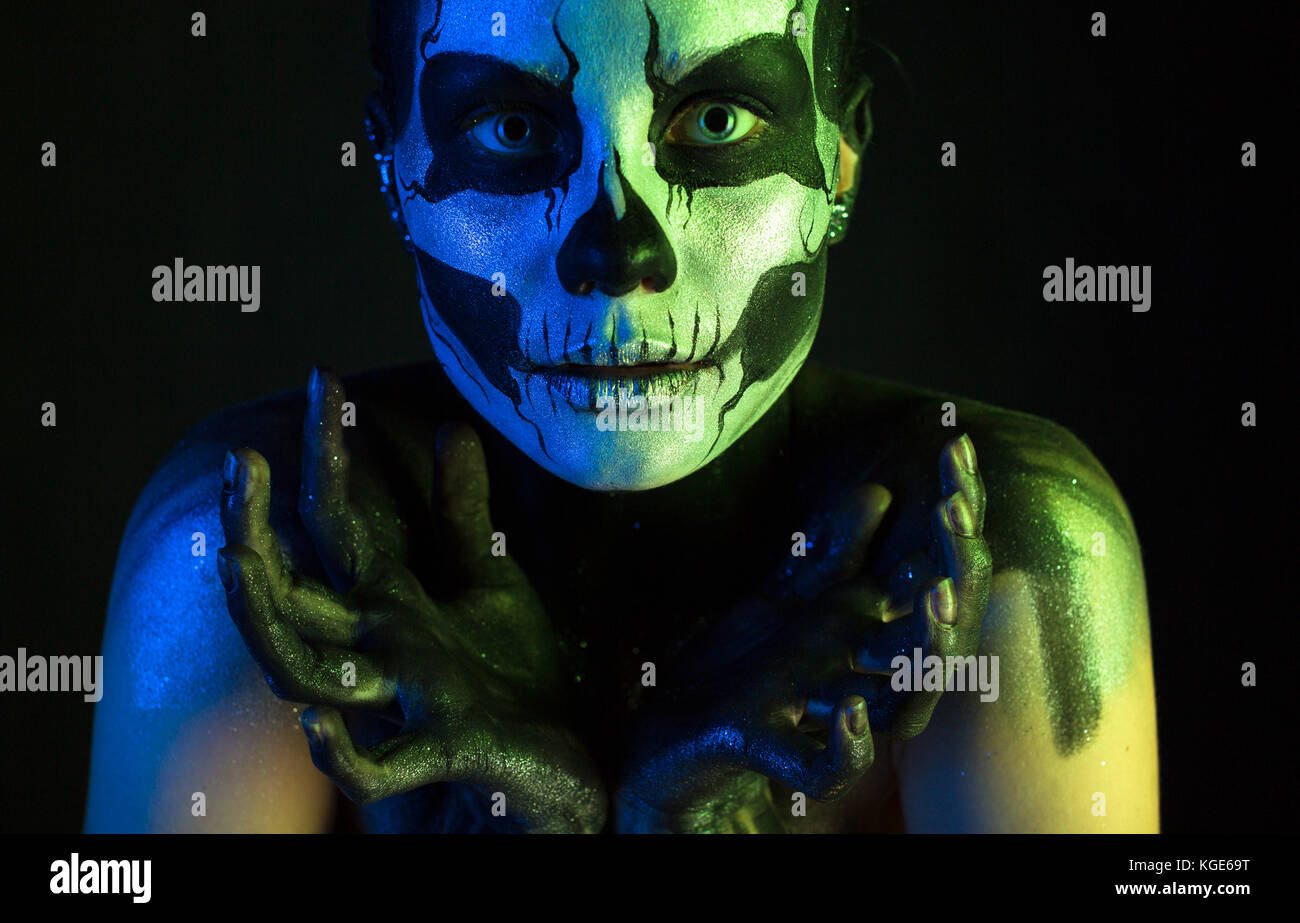 Beautiful creepy girl with skeleton makeup Stock Photo - Alamy