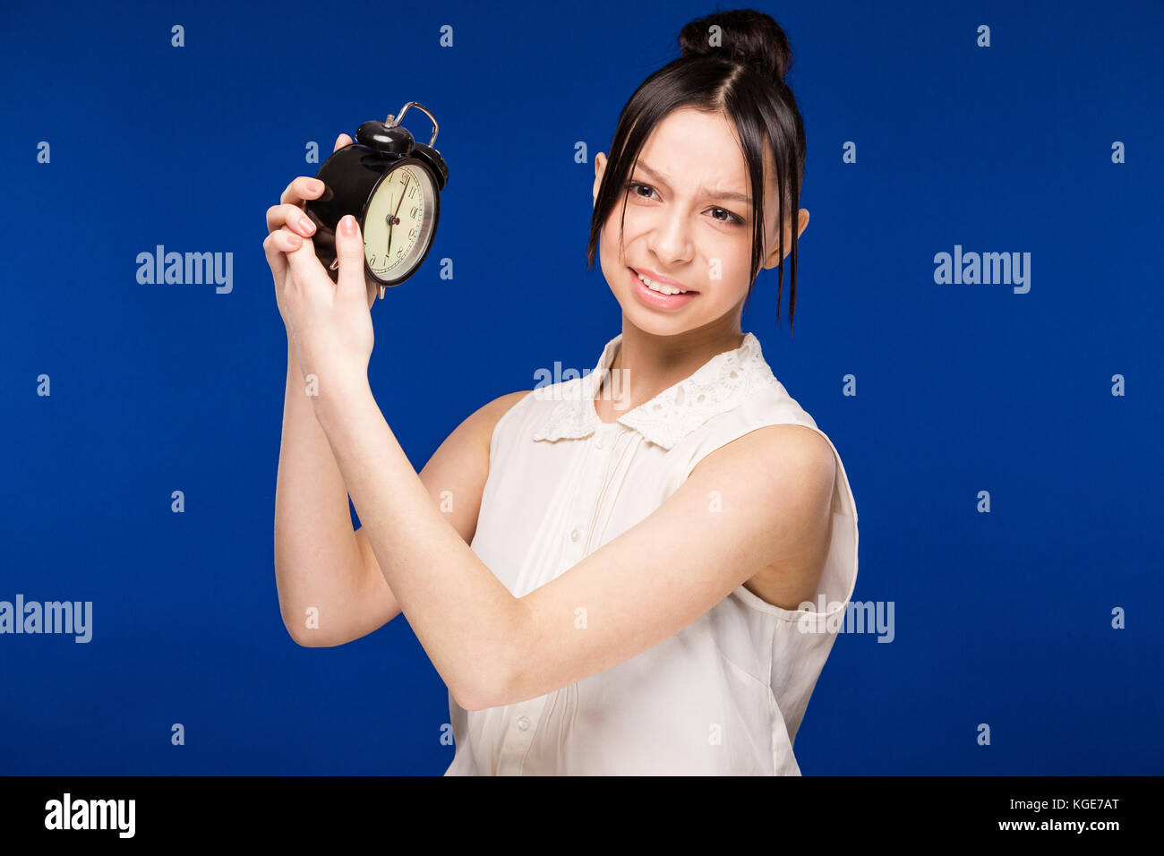 girl with an alarm clock Stock Photo - Alamy