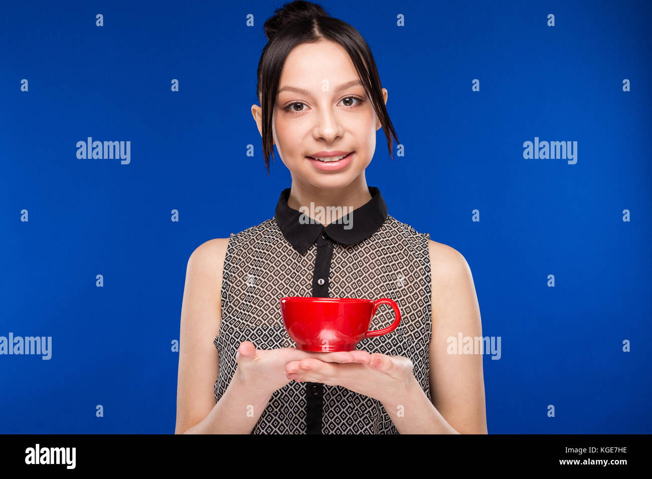 Girl with a cup Stock Photo - Alamy