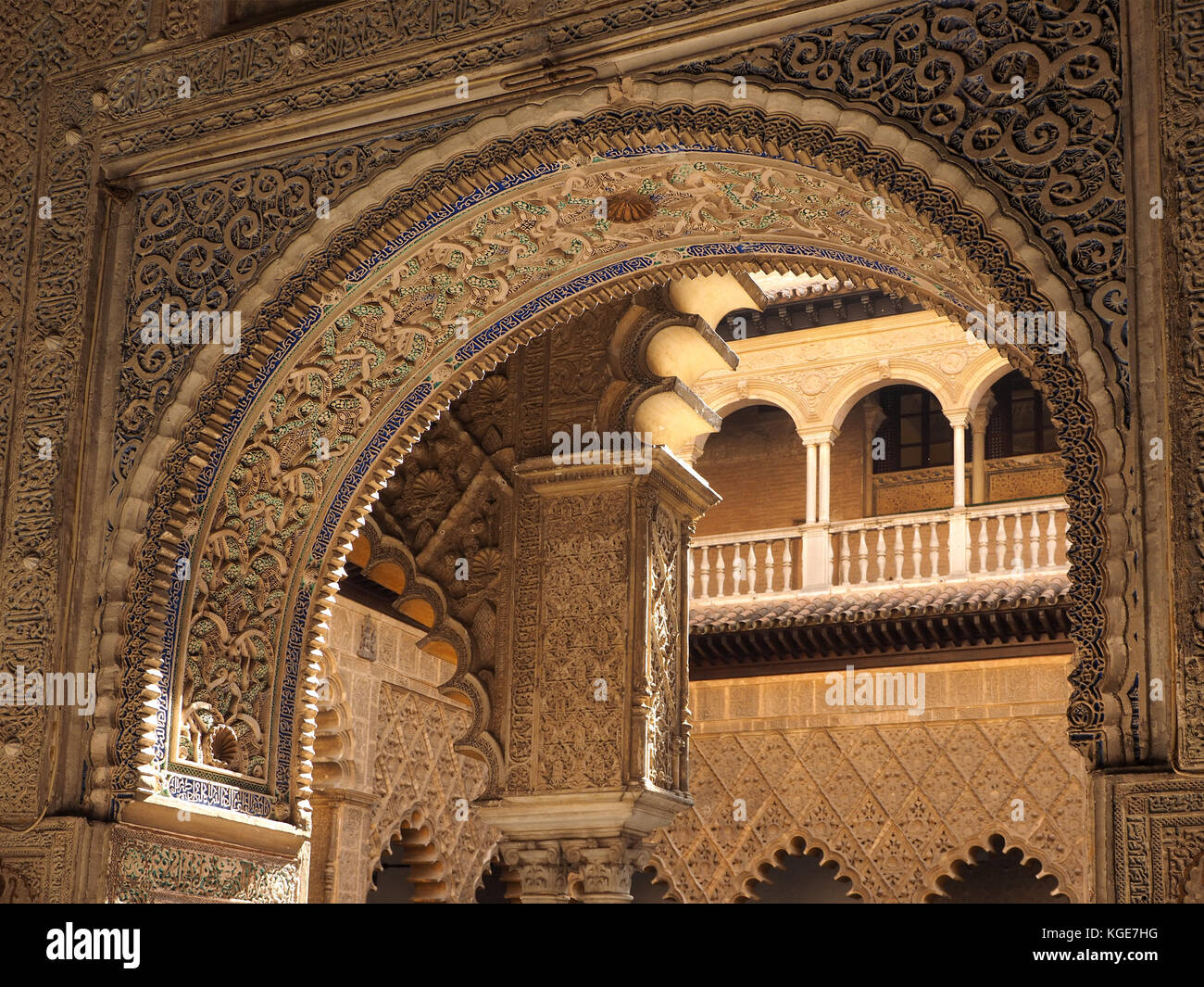 view through multiple carved gold & blue archways with Islamic designs ...