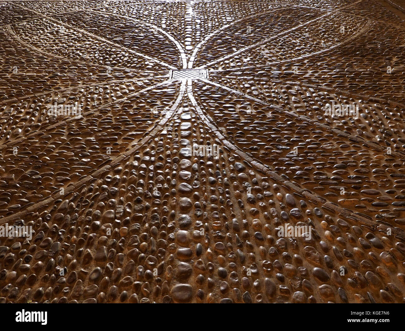 patterns set in stones in a cobbled entranceway to the Royal Alcázar of ...