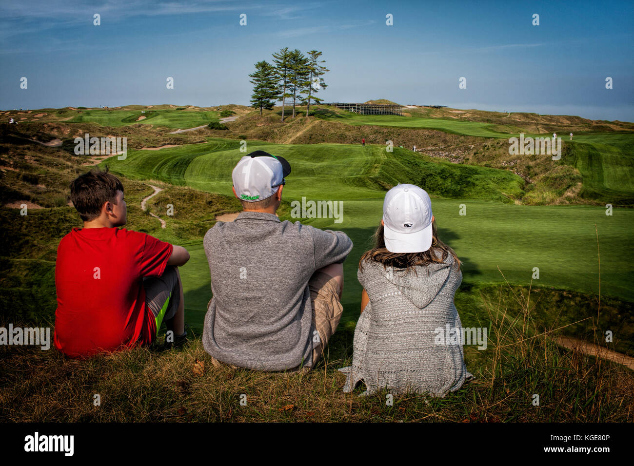 Kids looking over Golf Course Stock Photo - Alamy