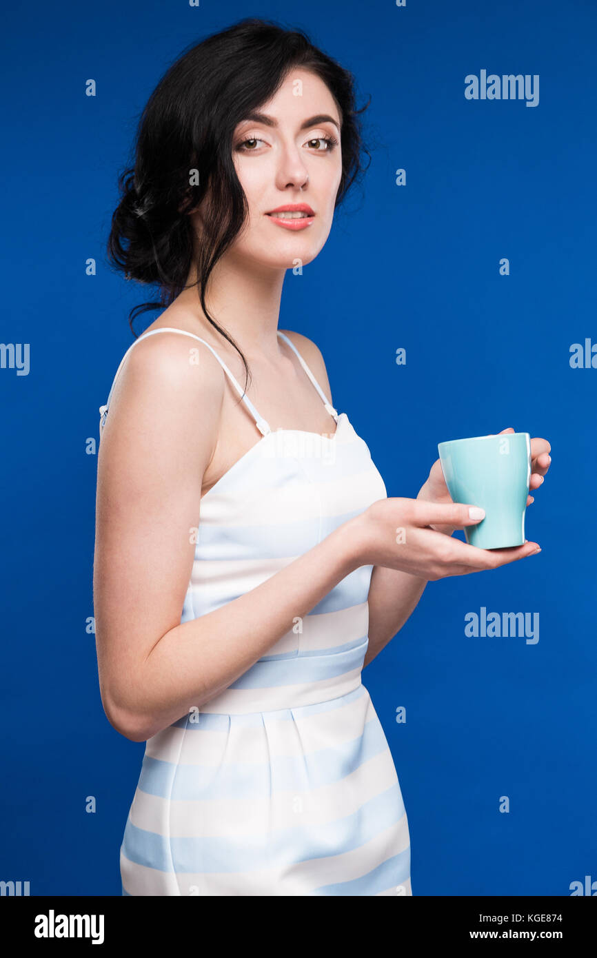 Girl with a cup Stock Photo - Alamy