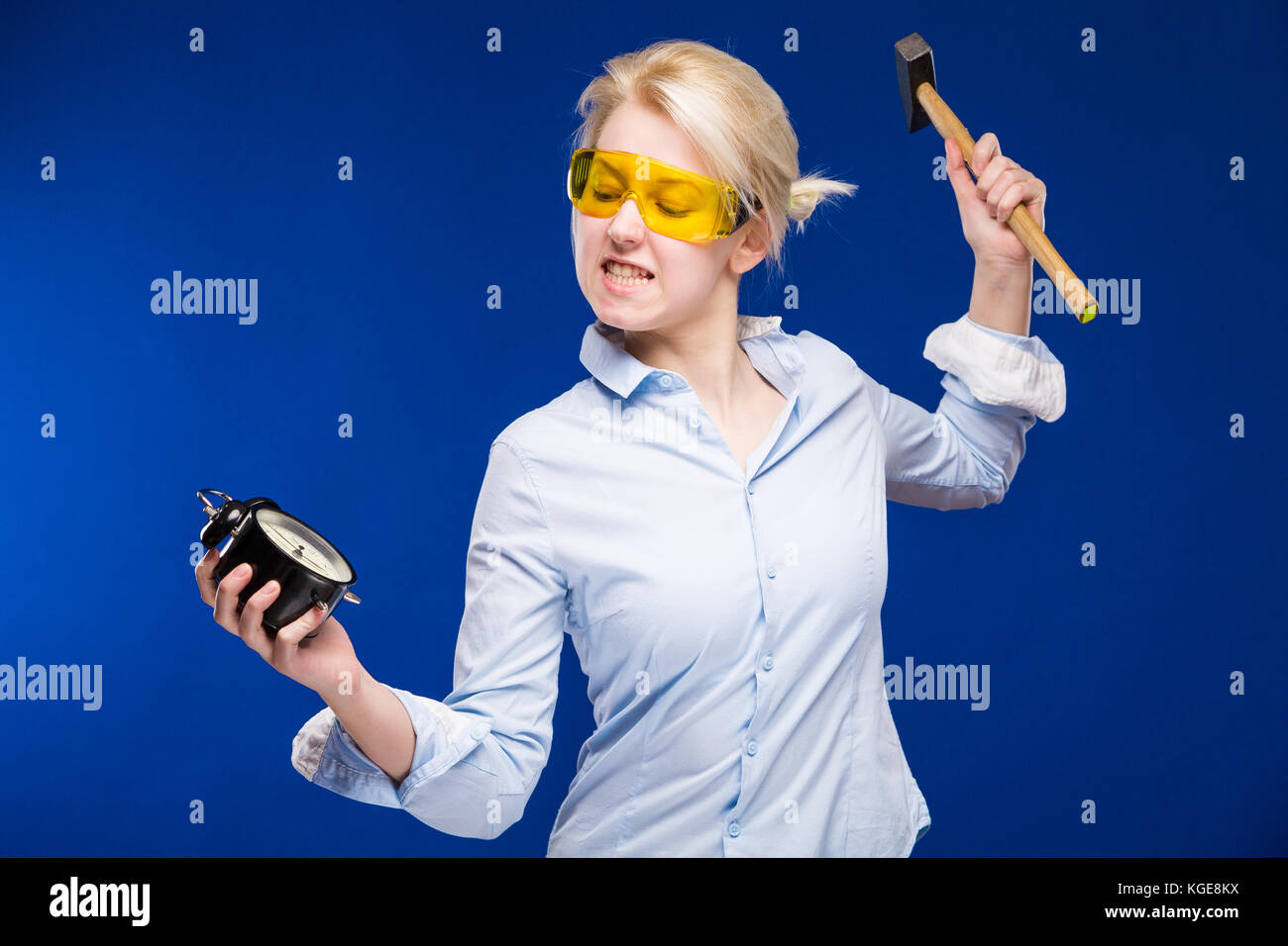 girl with hammer in the hands of Stock Photo - Alamy