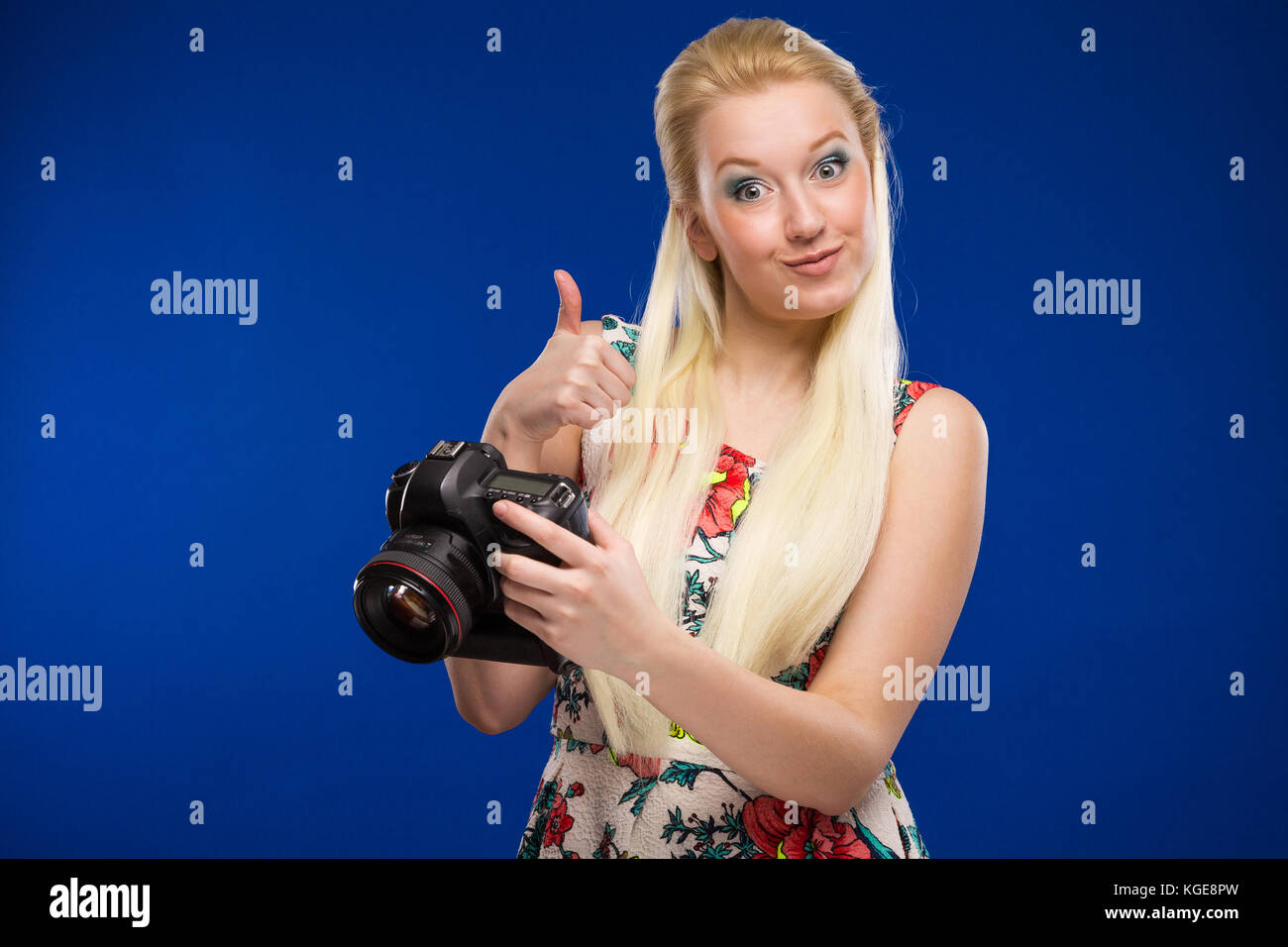 portrait of a girl with a camera in hands Stock Photo - Alamy