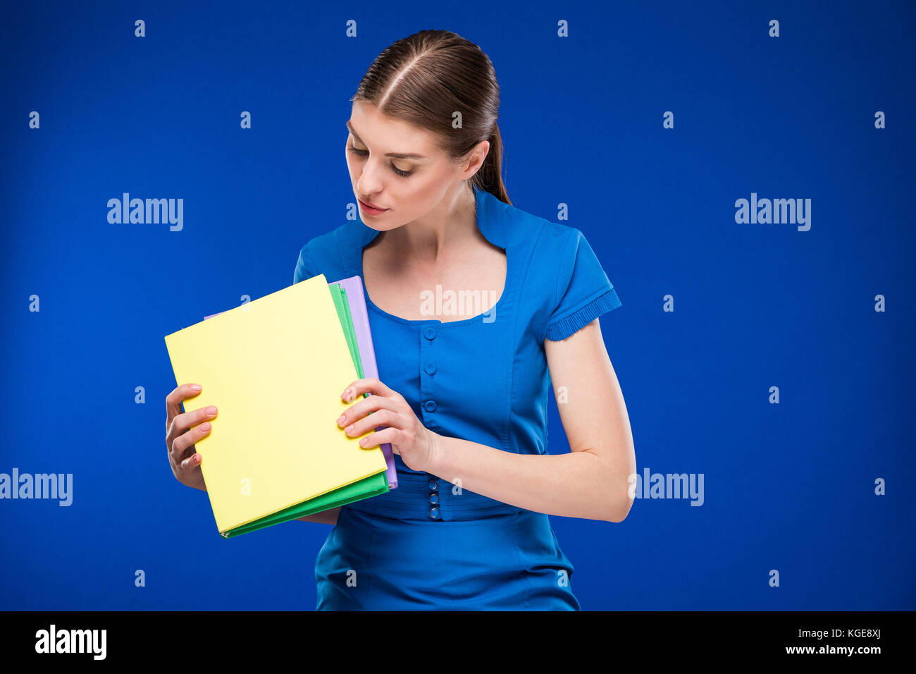 girl with books in hand Stock Photo - Alamy