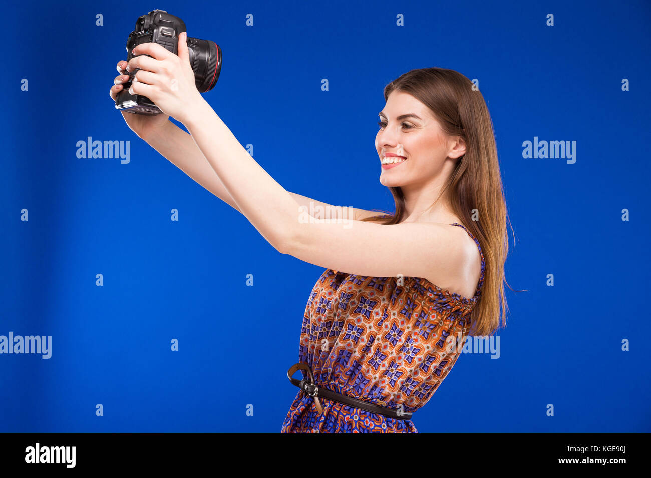 girl with a camera in his hands Stock Photo - Alamy