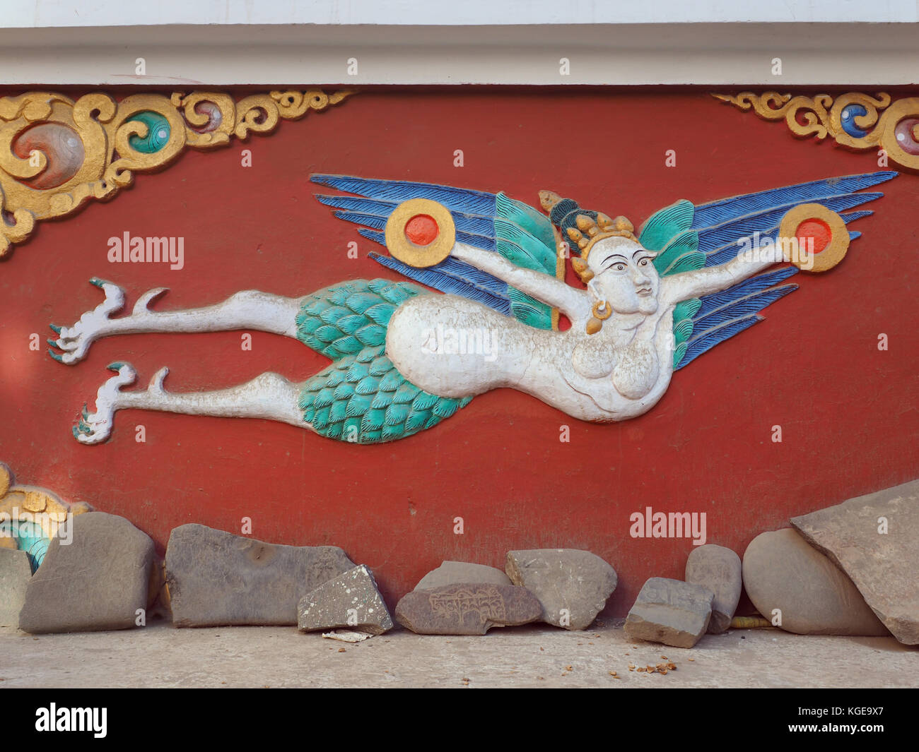 The mythological Tibetan god Garuda with white body and blue wings on ...