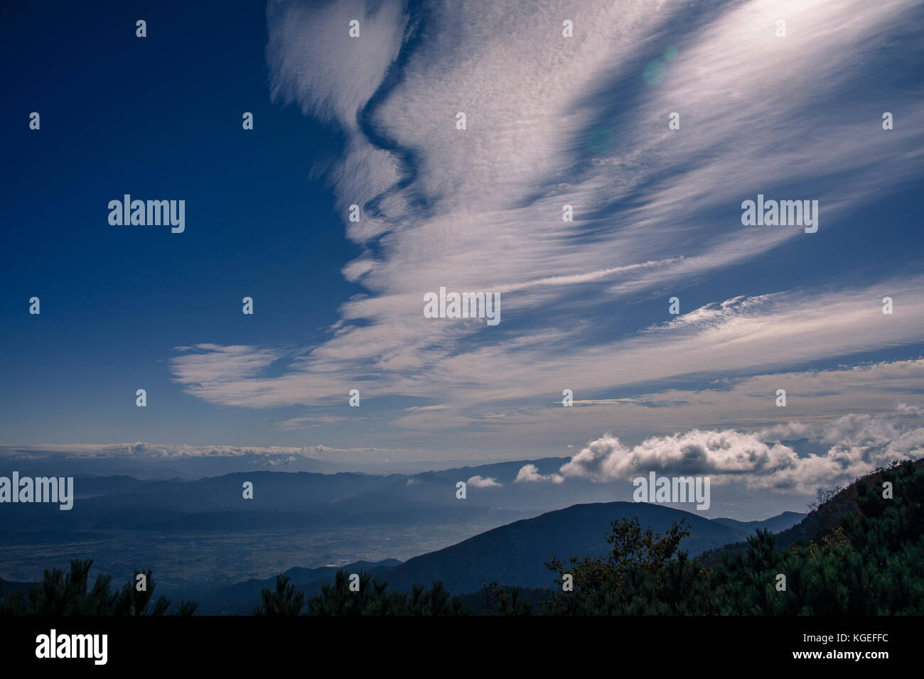 White clouds over mountains Stock Photo - Alamy