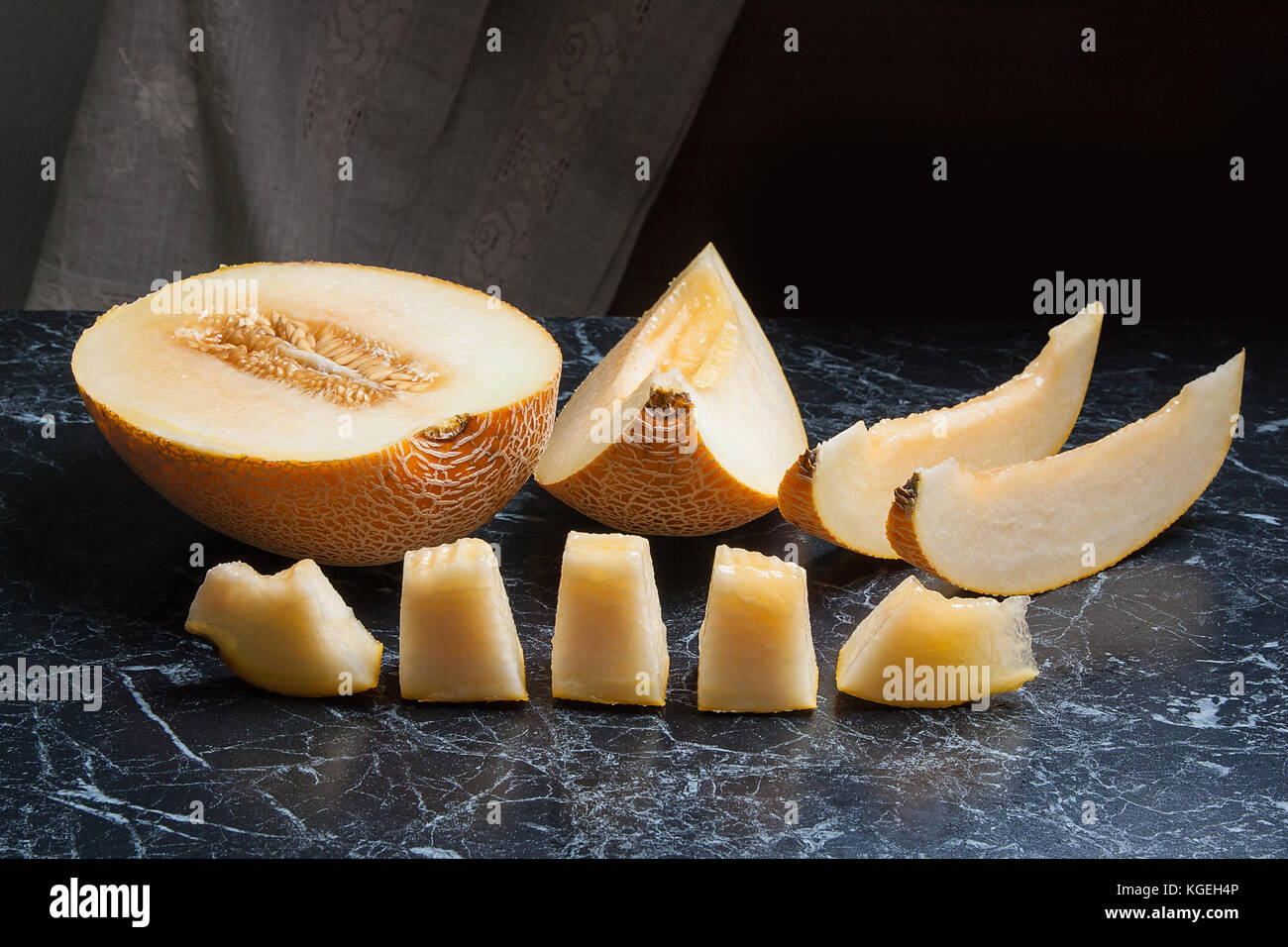 Sliced ripe juicy honeydew melon fruit at summer time. Composition on ...