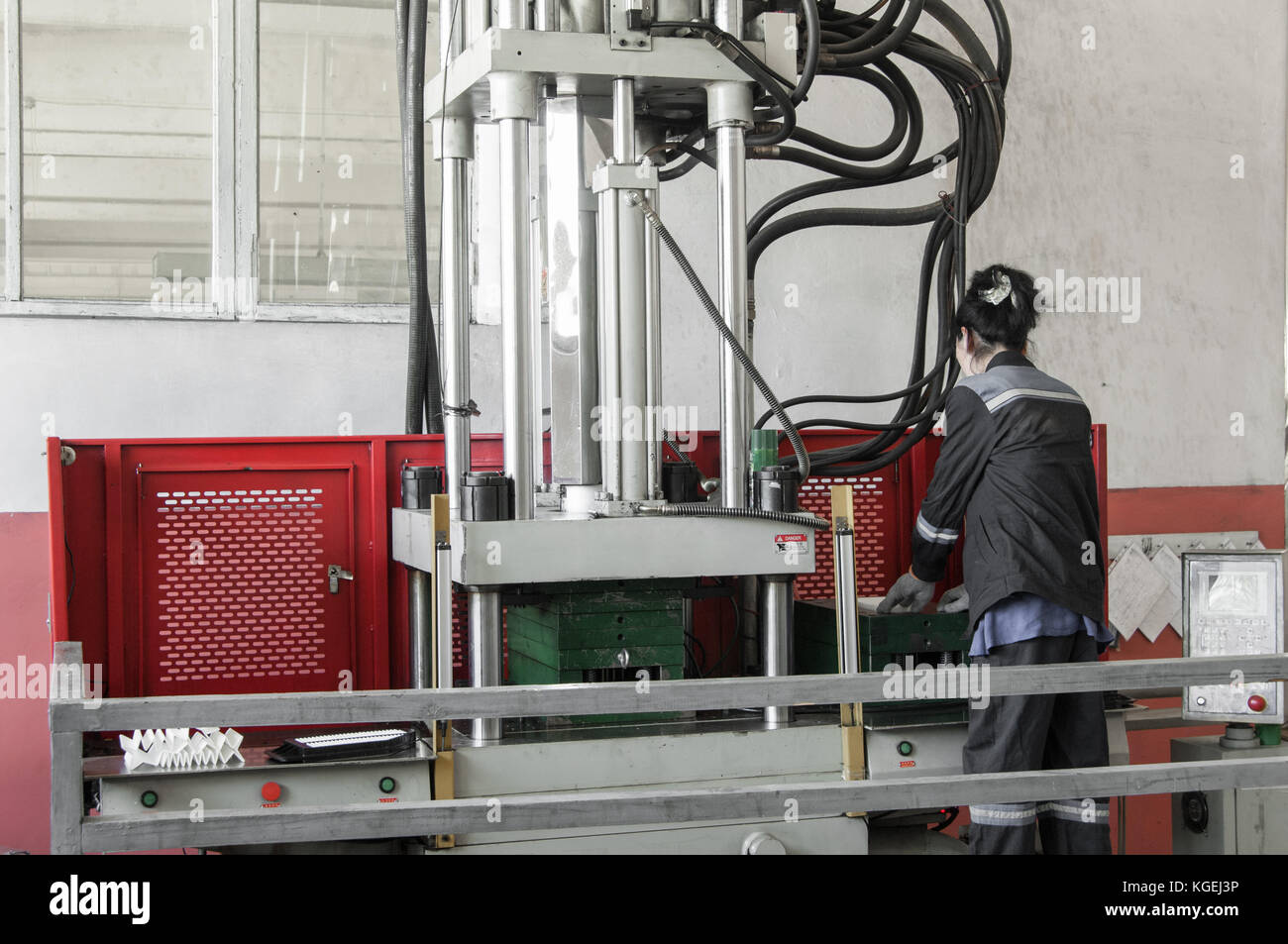 female factory worker produces filters for cars Stock Photo - Alamy