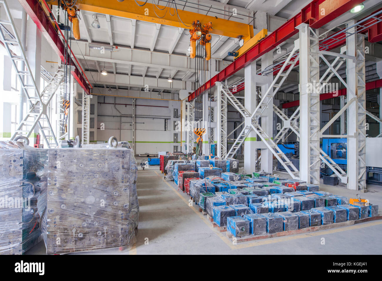 warehouse storage machines molds packed in polyethylene and hoisting ...
