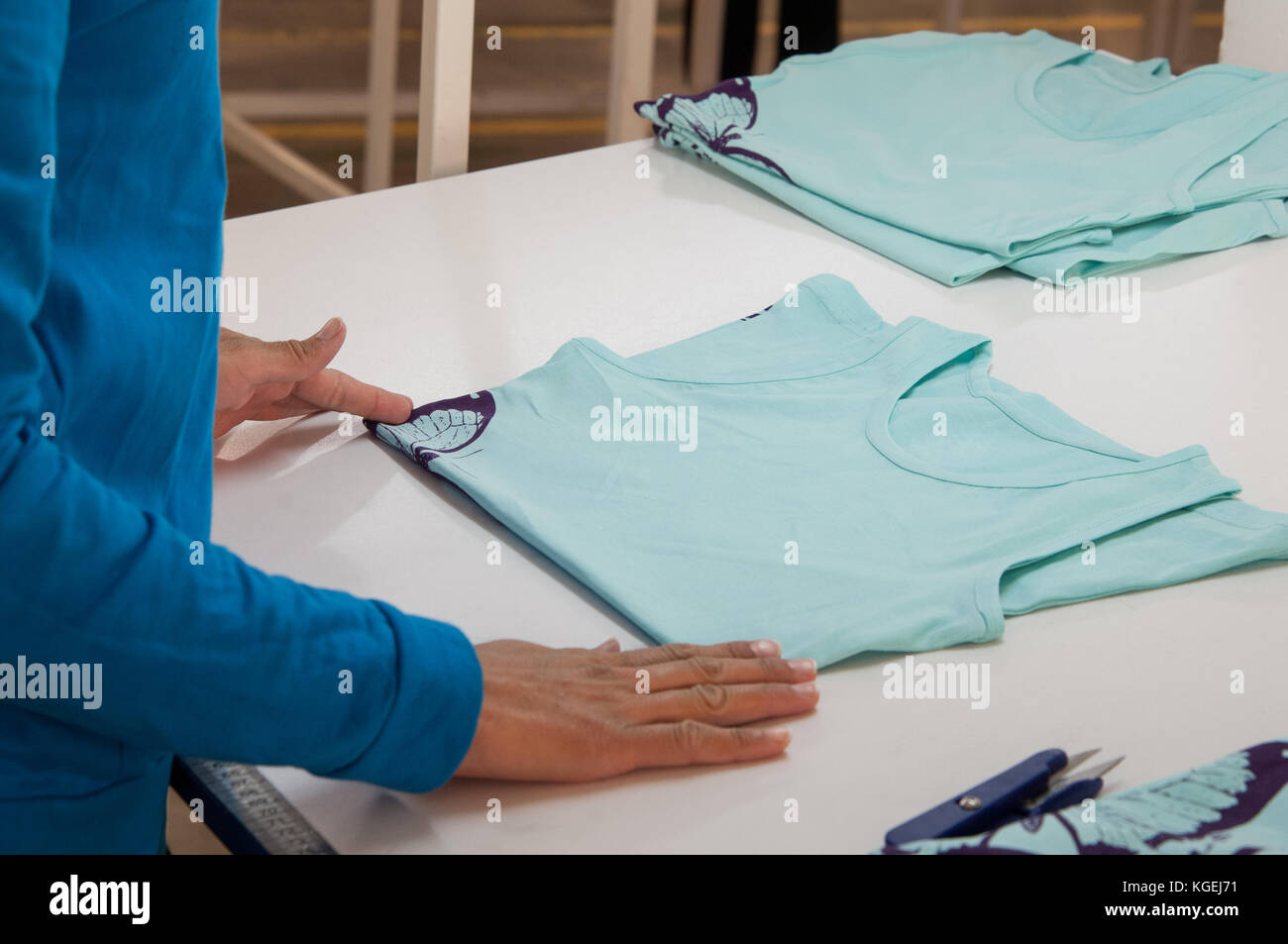 at a garment factory quality control check for defects Stock Photo - Alamy