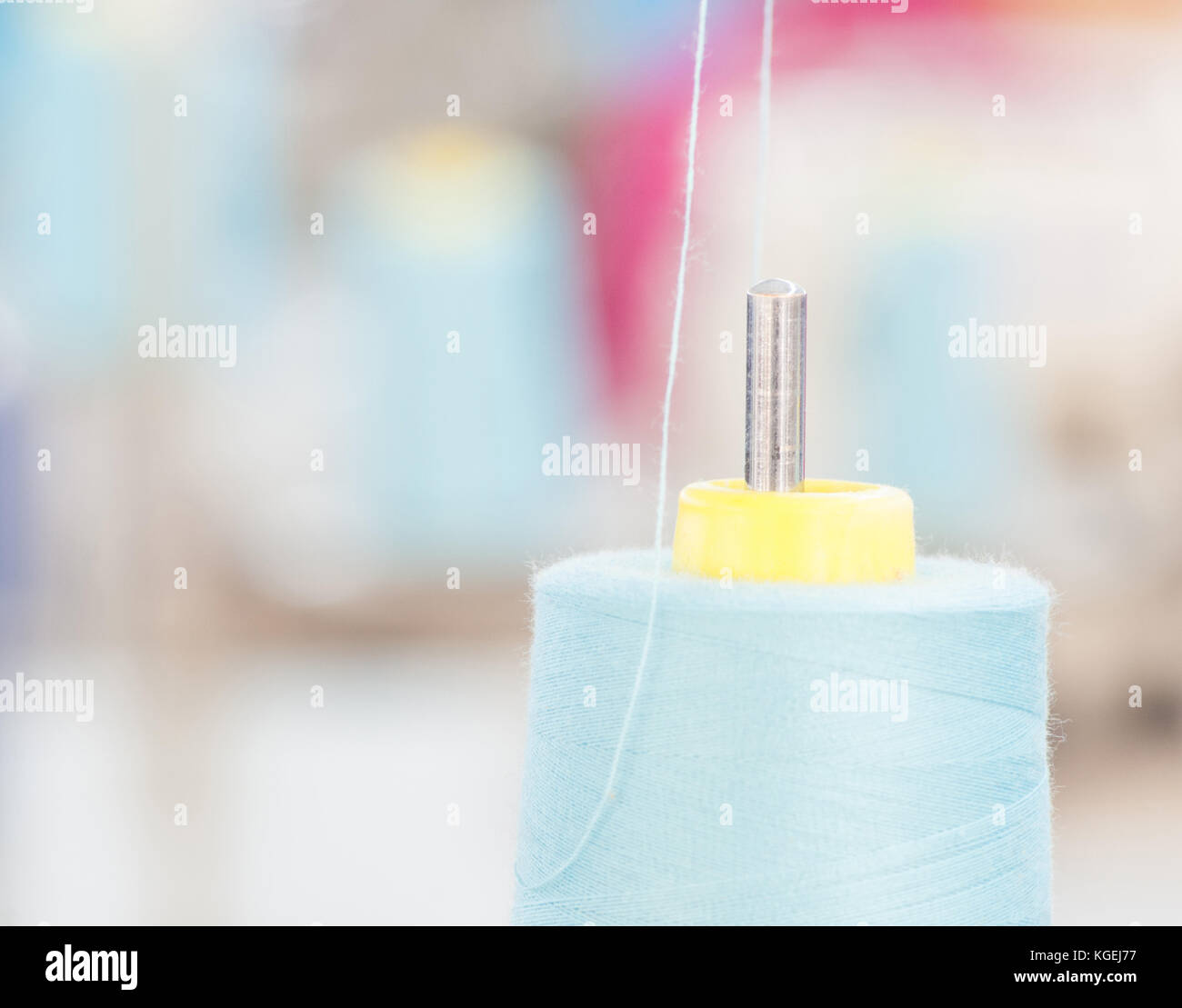spool of thread close-up on a blurred background Stock Photo - Alamy