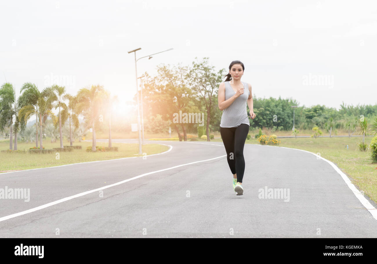 Running woman. Female runner jogging during outdoor workout at health ...
