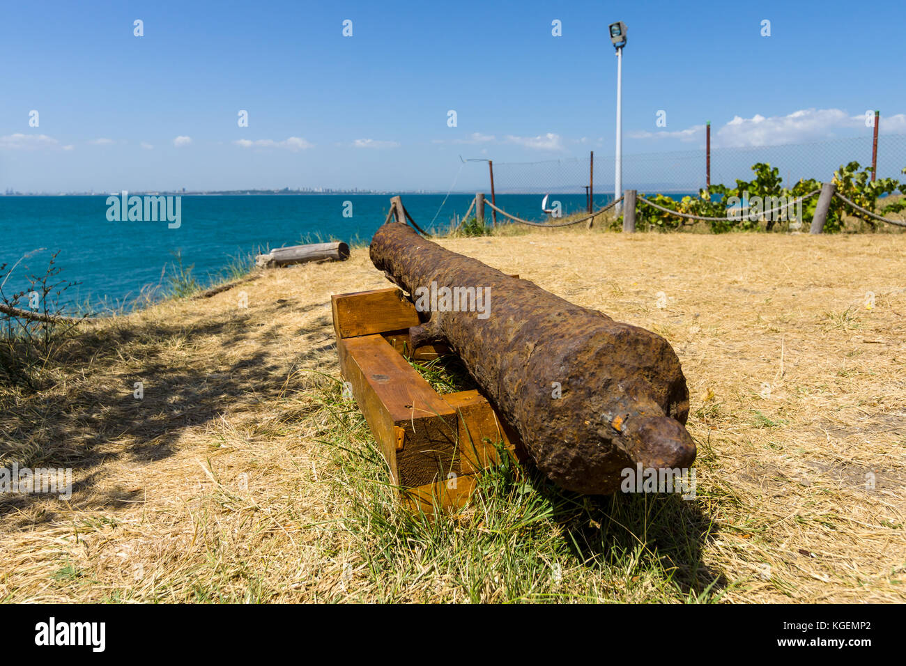 An ancient rusty cannon aimed at the side of the sea Stock Photo - Alamy