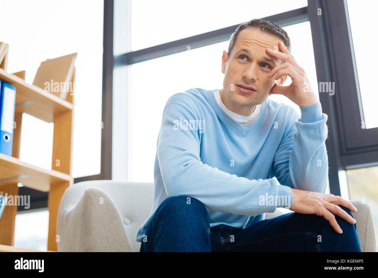 Unhappy handsome man feeling depressed Stock Photo - Alamy