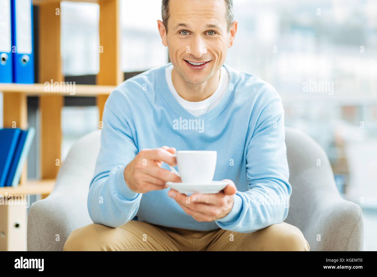 Happy delighted man smiling Stock Photo - Alamy