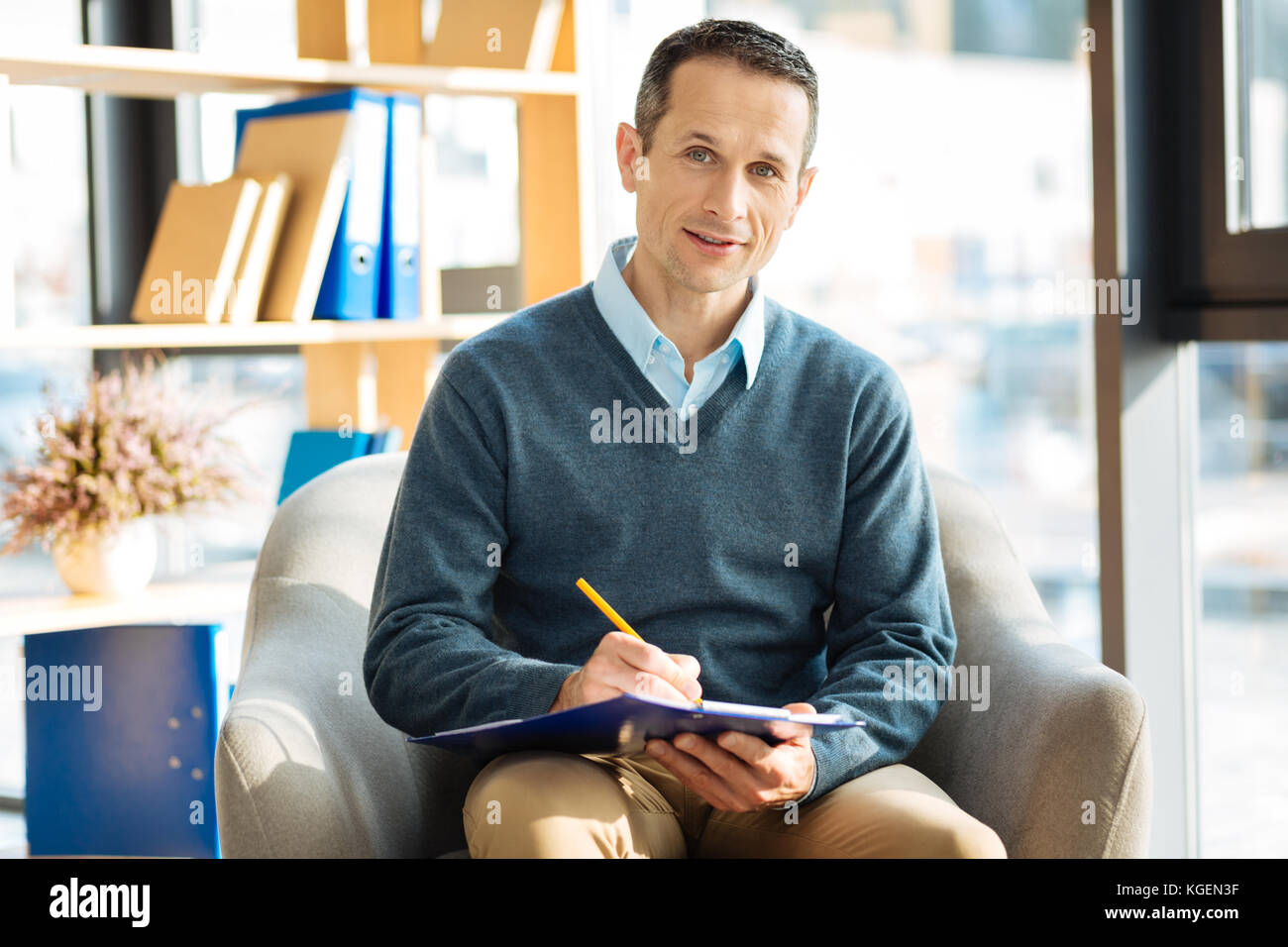 Healthcare professional writing notes indoors hi-res stock photography ...