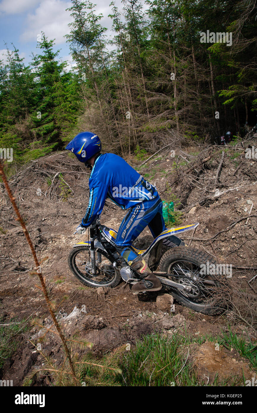 Motorcross bike rider on a cross trail showing of skills on a difficult ...
