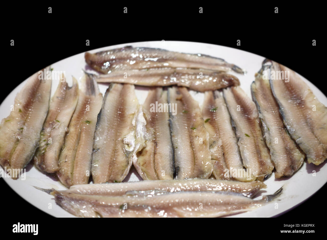 Raw anchovy tapa plate prepared with vinegar Stock Photo - Alamy