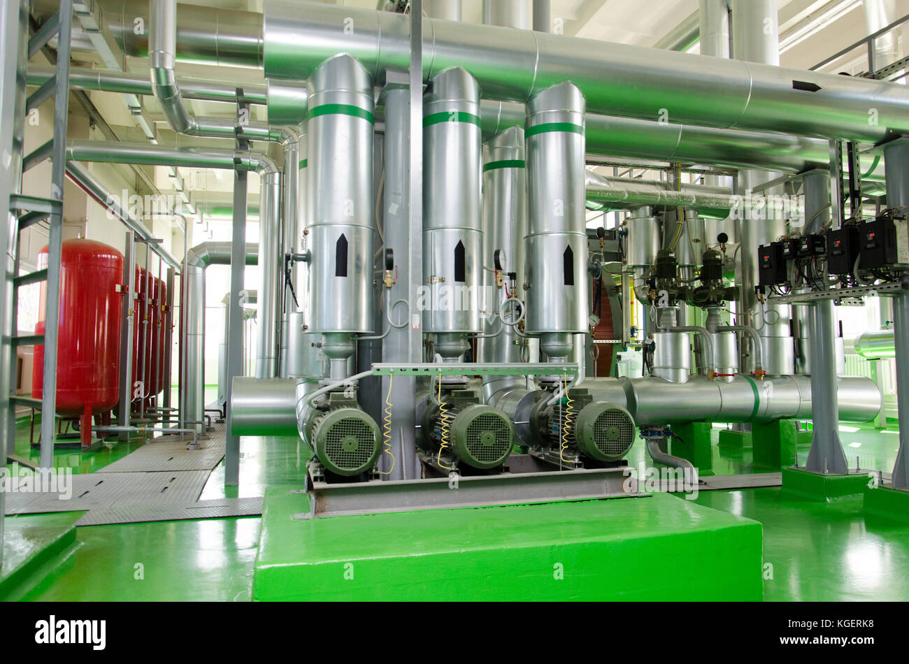 The interior of a modern industrial gas boiler room. Pipelines, water ...