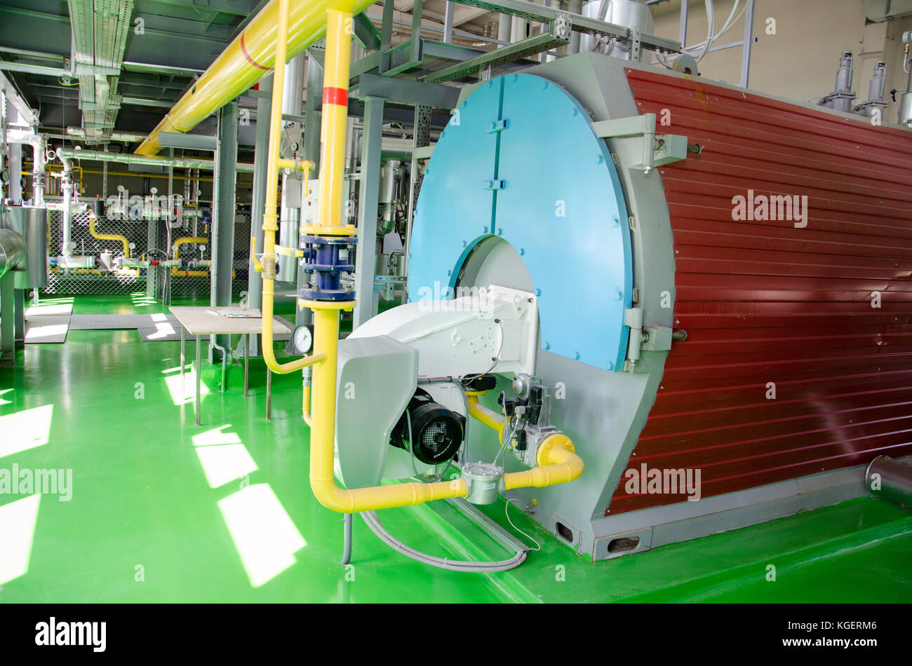 The interior of a modern industrial gas boiler room. Pipelines, water ...