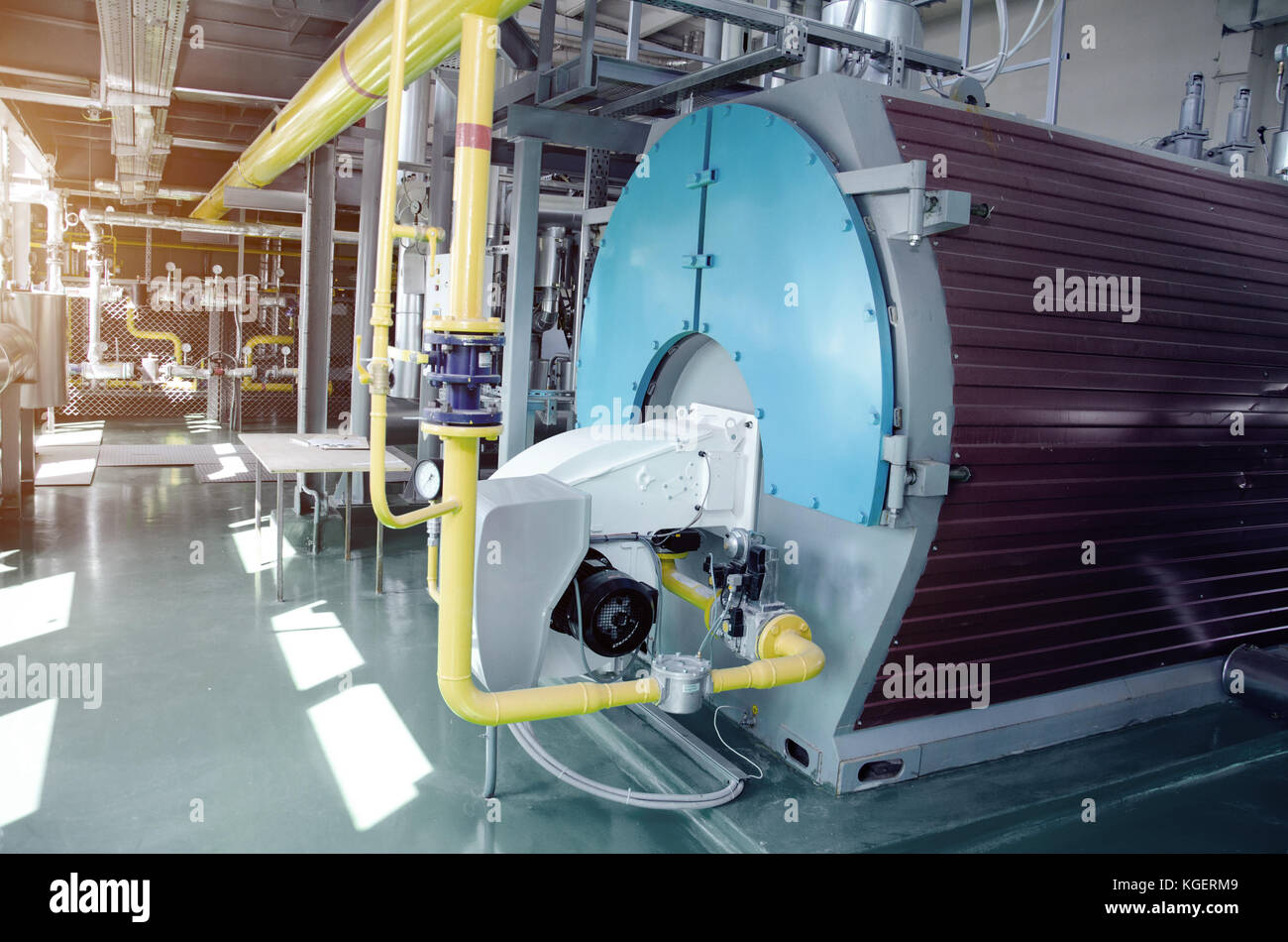The interior of a modern industrial gas boiler room. Pipelines, water ...