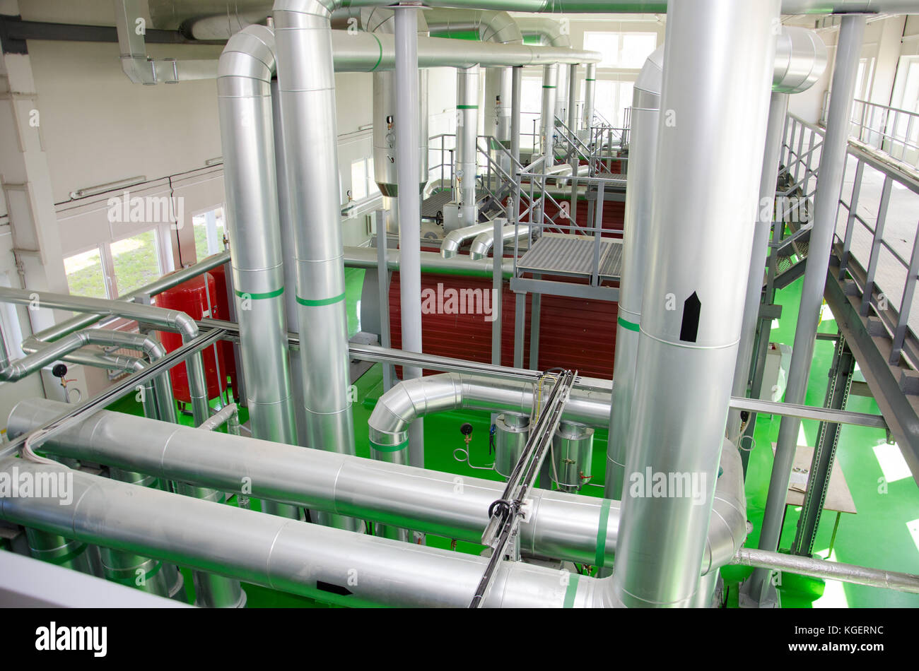 The interior of a modern industrial gas boiler room. Pipelines, water ...