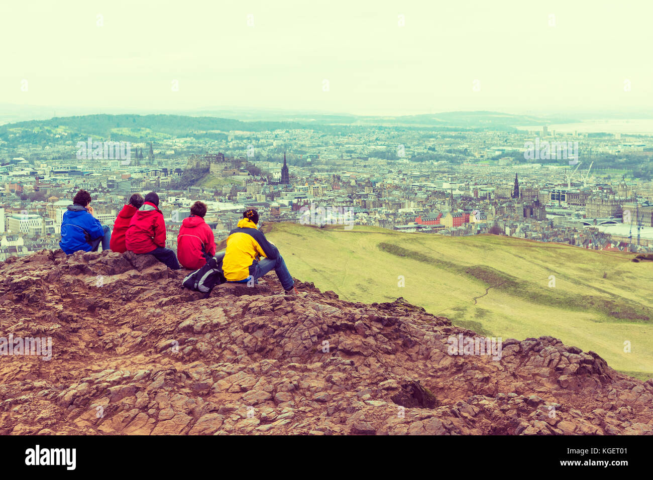 Family enjoying view of Edinburgh from top of Arthurs seat, ancient ...