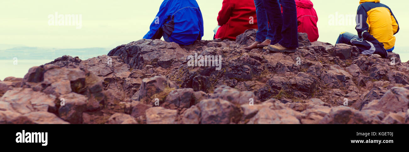 Family enjoying view of Edinburgh from top of Arthurs seat, ancient ...