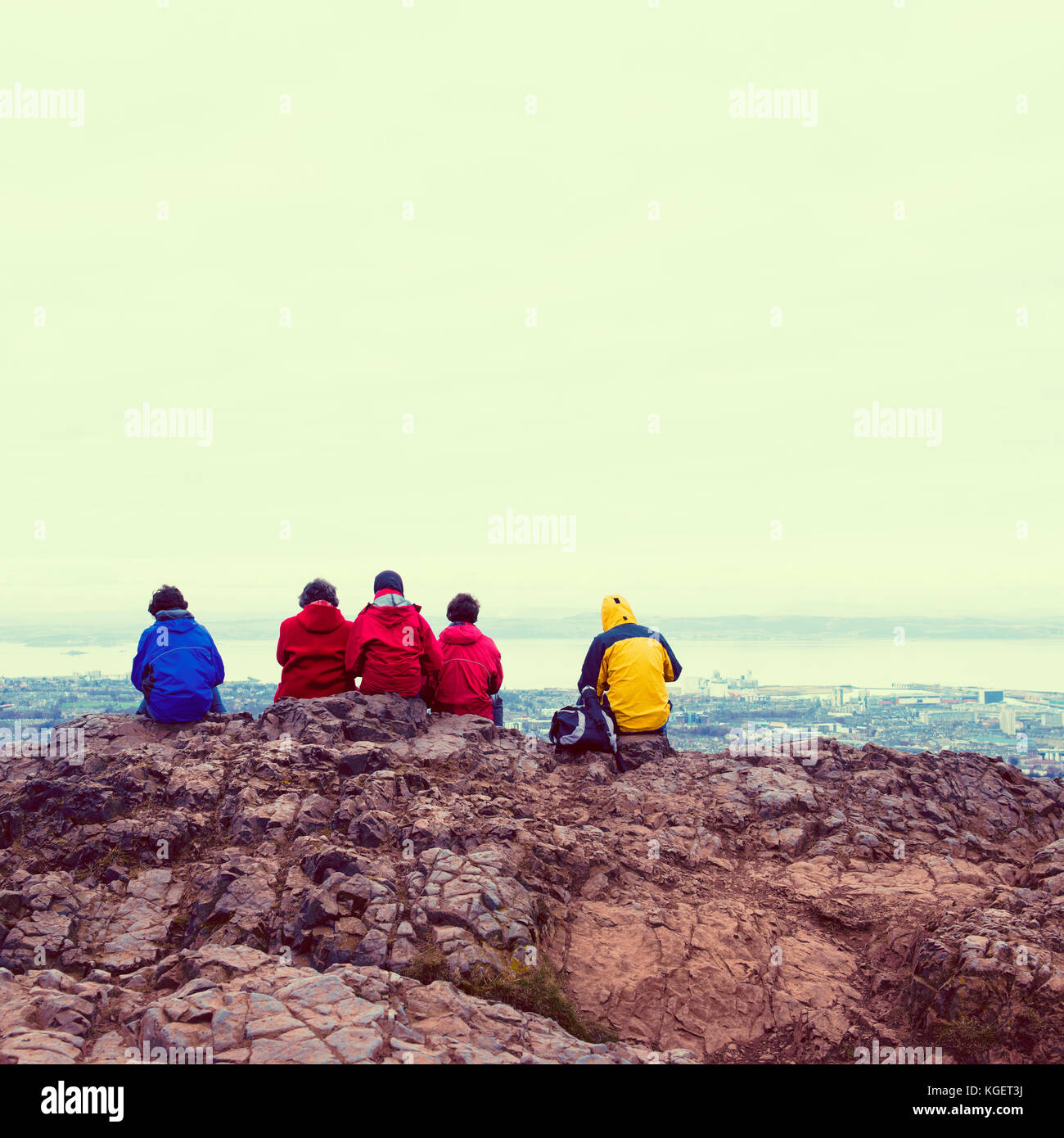Family enjoying view of Edinburgh from top of Arthurs seat, ancient ...