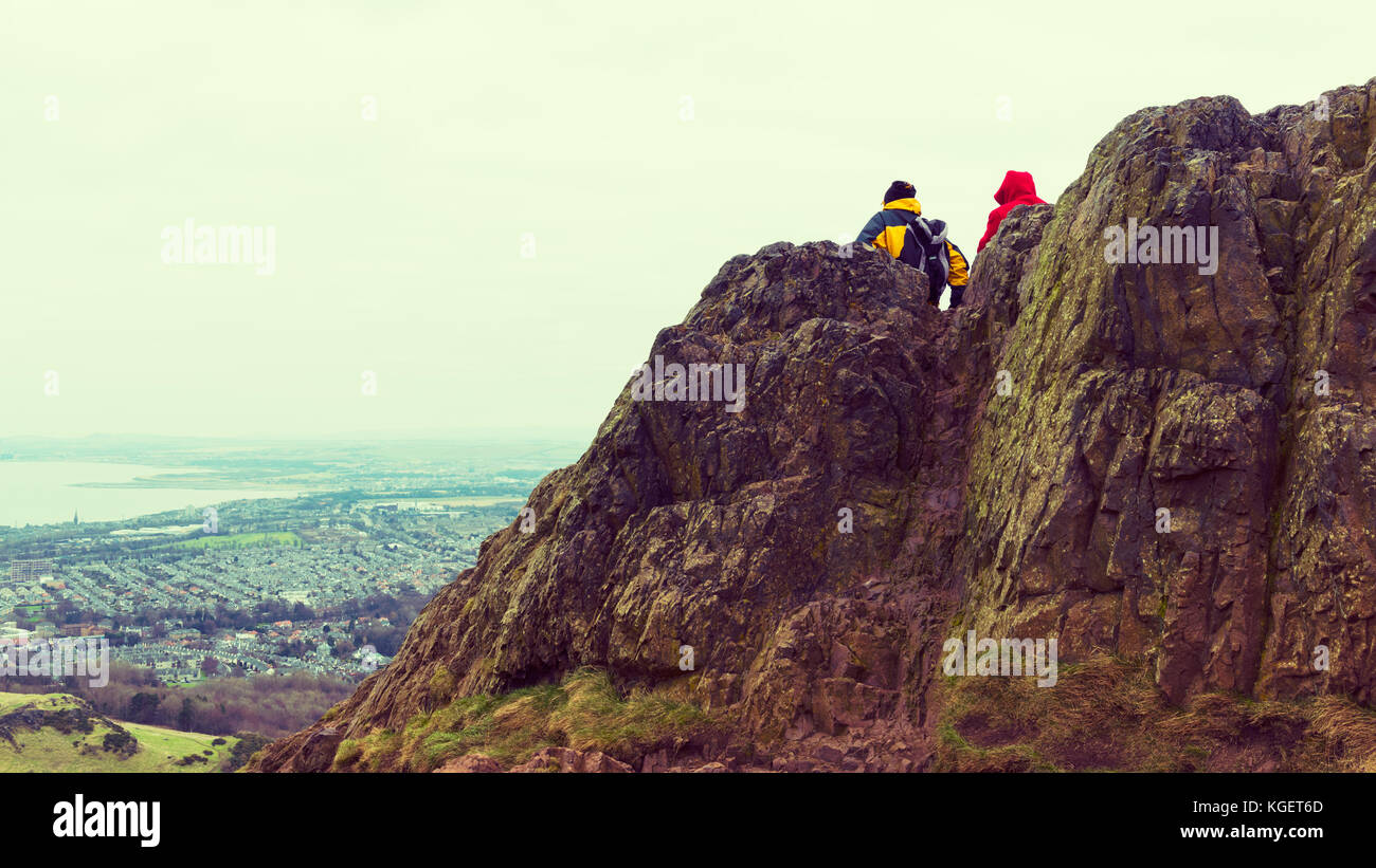 Family enjoying view of Edinburgh from top of Arthurs seat, ancient ...
