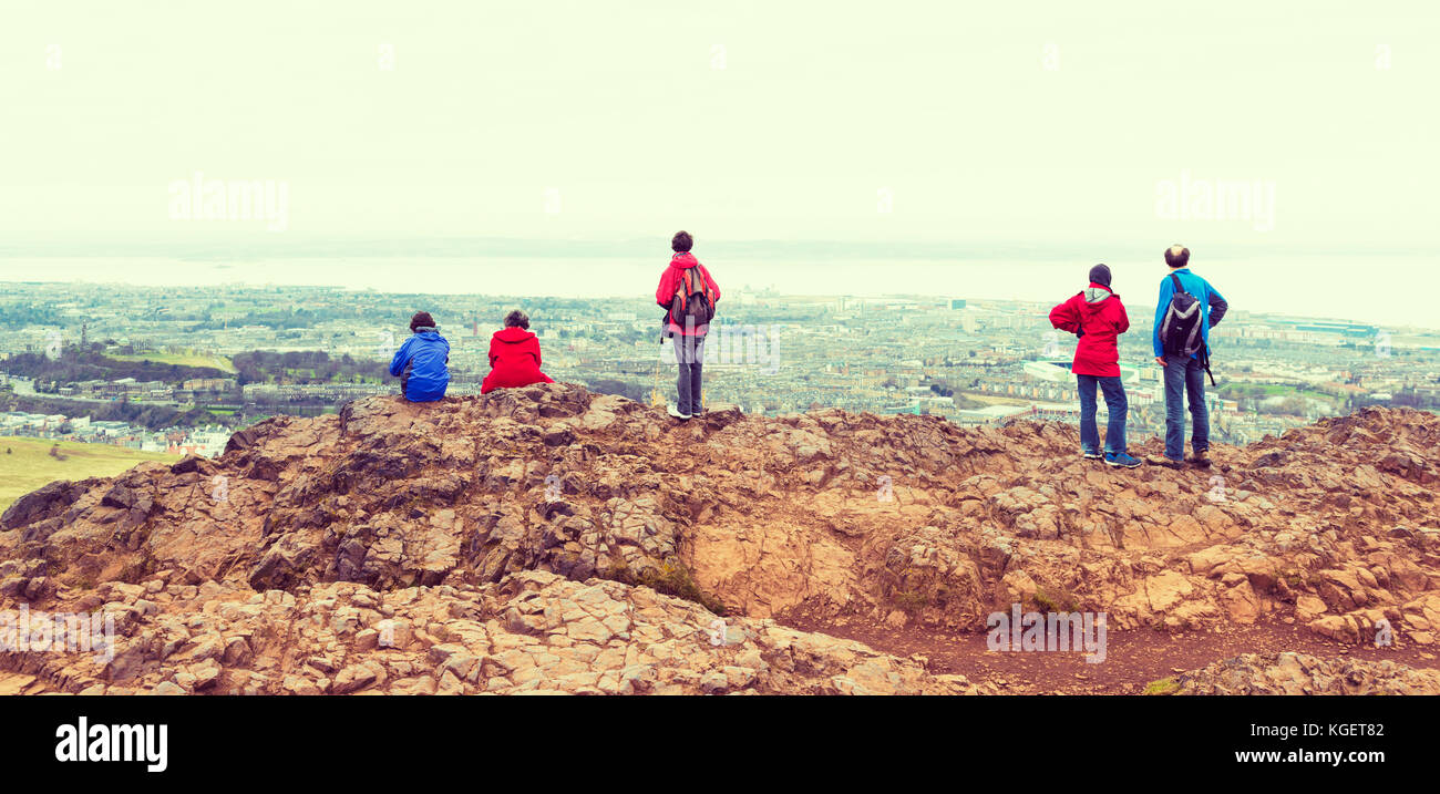 Family enjoying view of Edinburgh from top of Arthurs seat, ancient ...