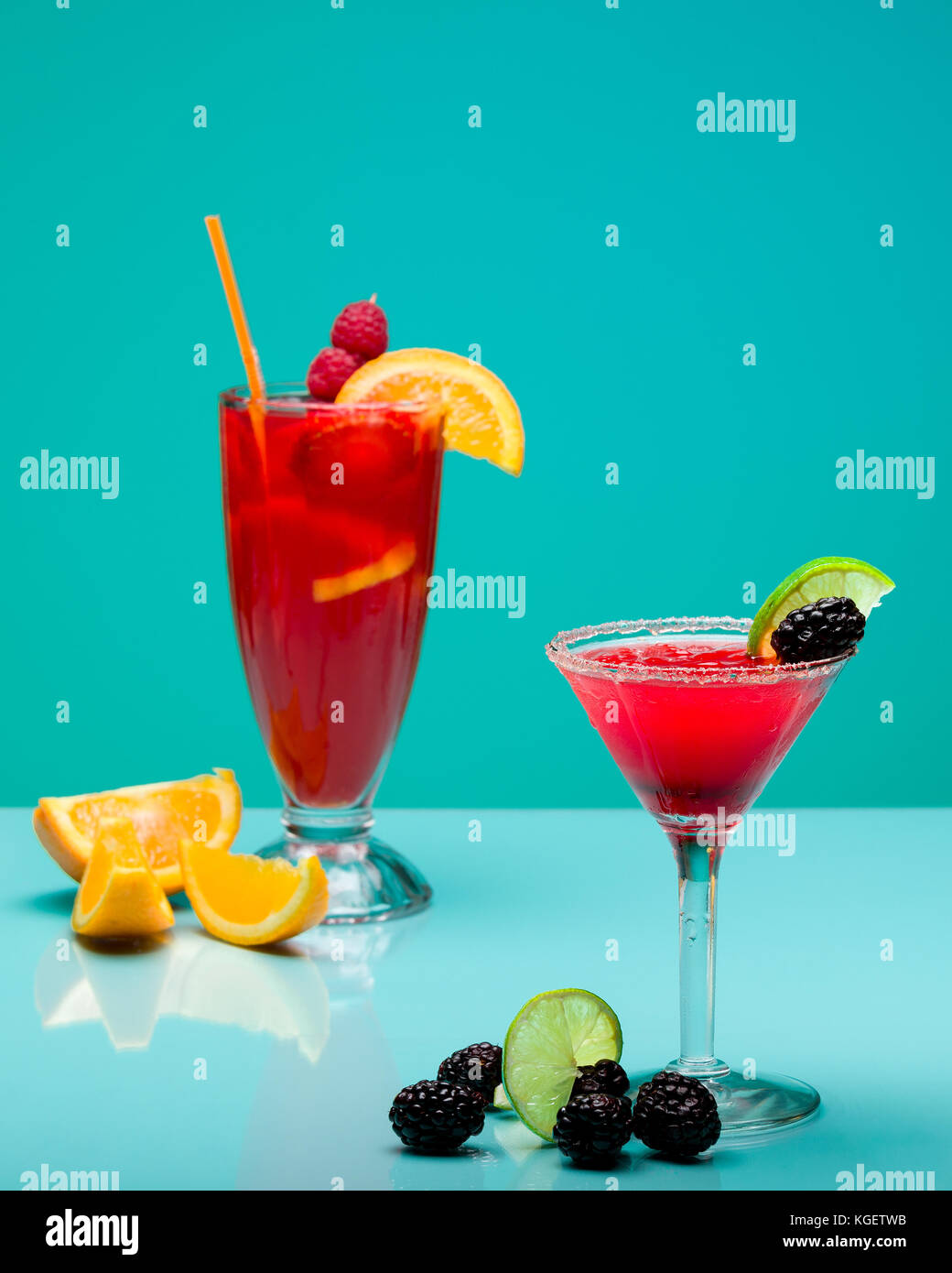 Refreshing fruit cocktails on pastel turquoise background Stock Photo ...