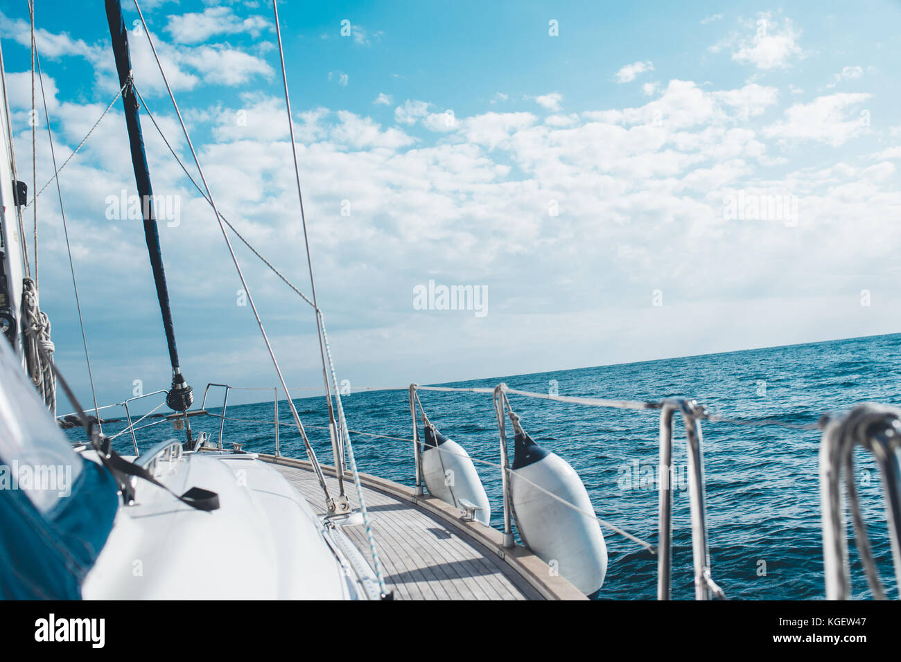 Yacht sailing in the tropical sea Stock Photo - Alamy