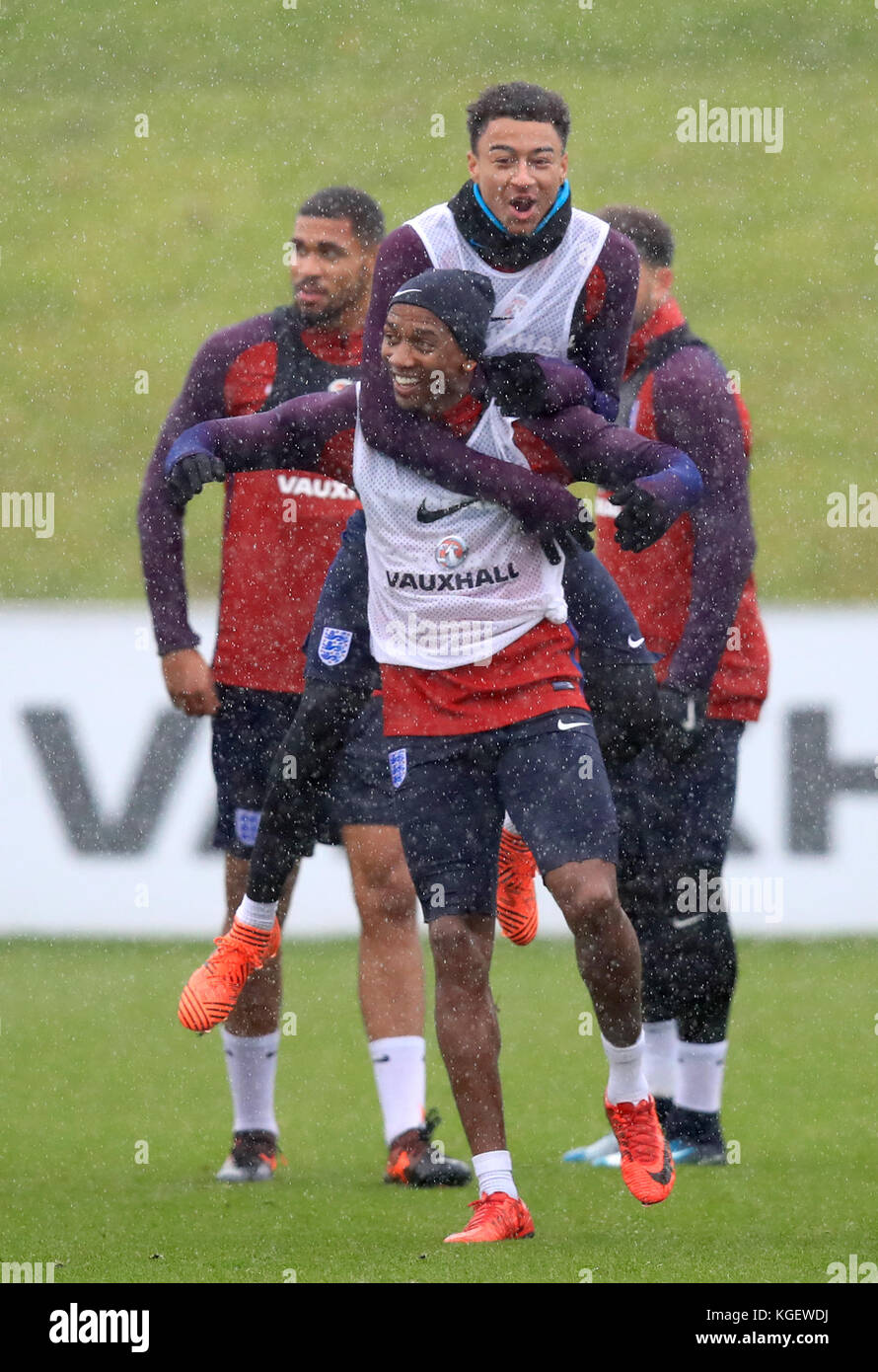 England's Jesse Lingard (top) and Ashley Young during the training ...