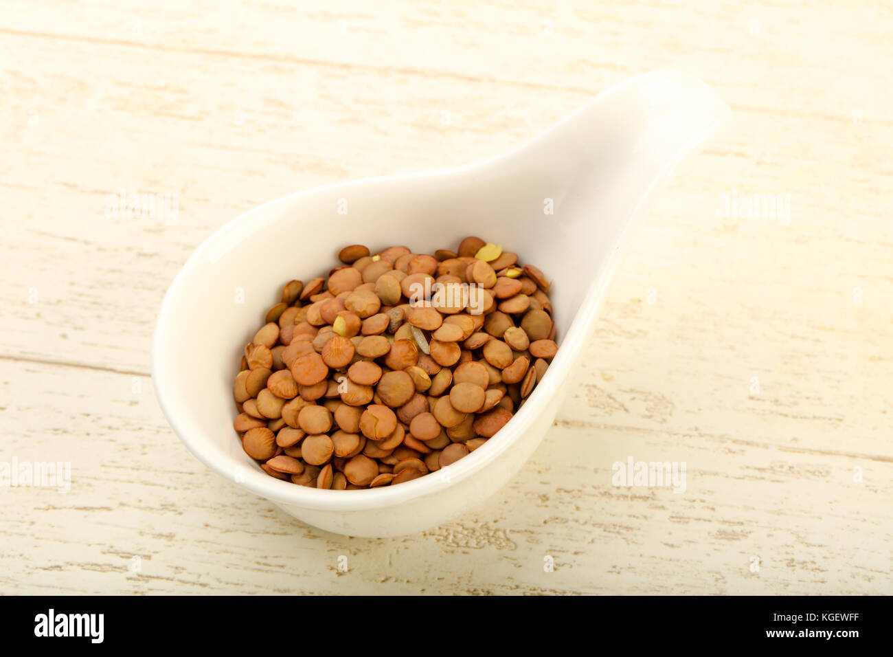 Raw lentils in the bowl ready for cooking Stock Photo - Alamy