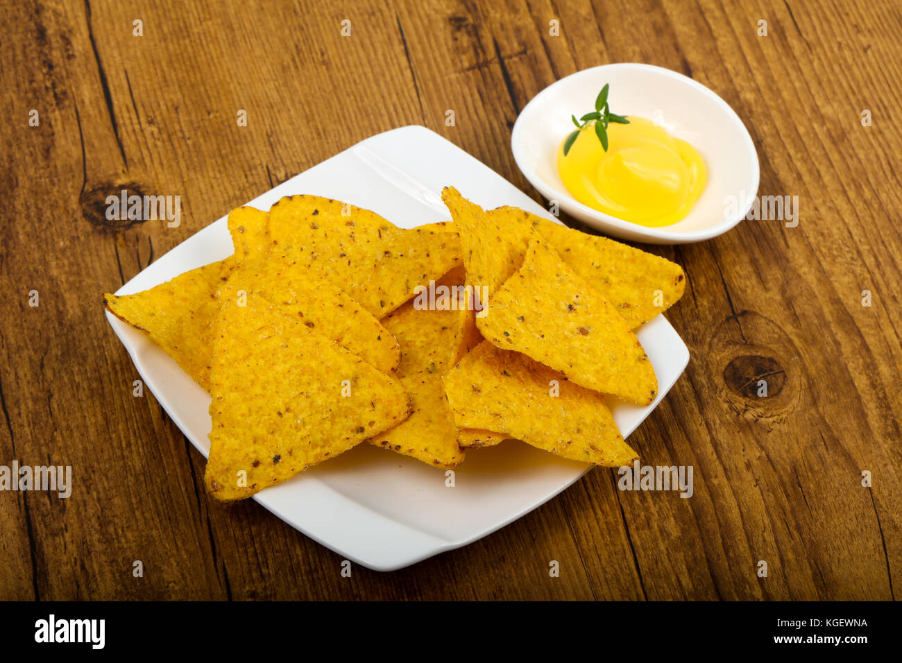 Nachos with cheese sauce Stock Photo - Alamy