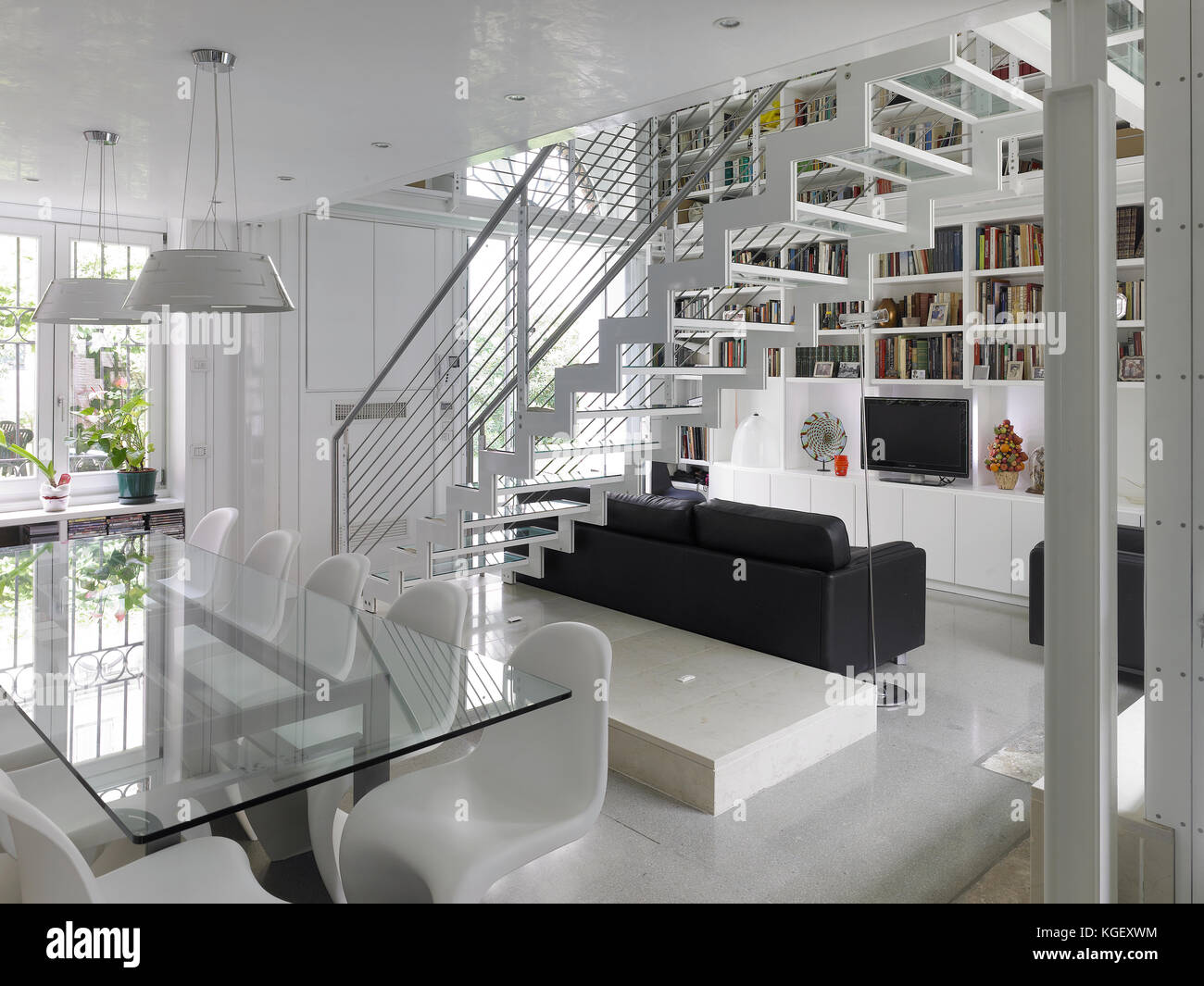 Contemporary loft studio with white wall and white furnitures Stock ...