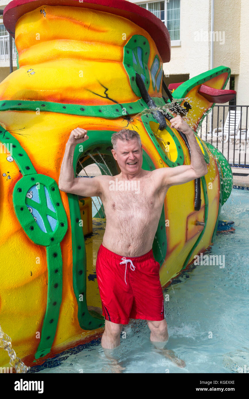 Senior Man Enjoying Resort Swimming Pool, USA Stock Photo - Alamy